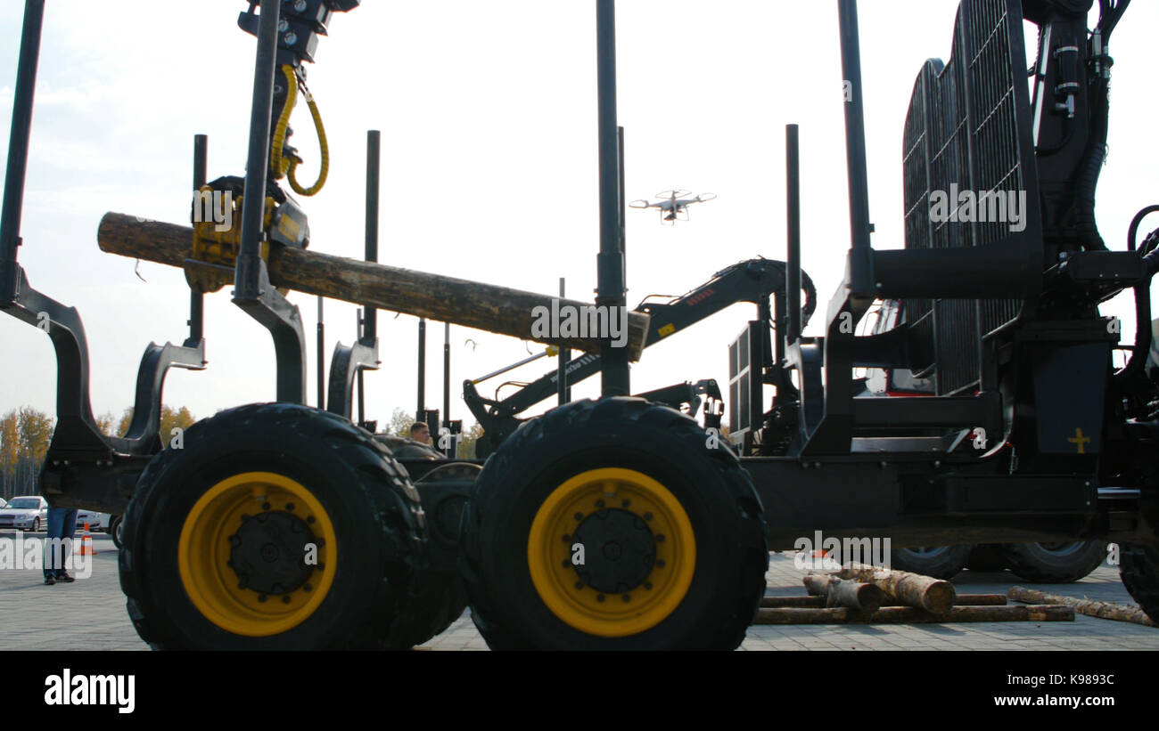 Log loader or forestry machine moves fresh cut logs for loading Stock ...