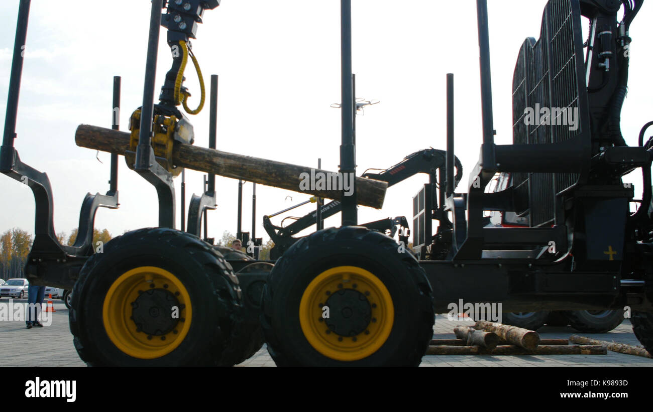 Log loader or forestry machine moves fresh cut logs for loading Stock ...