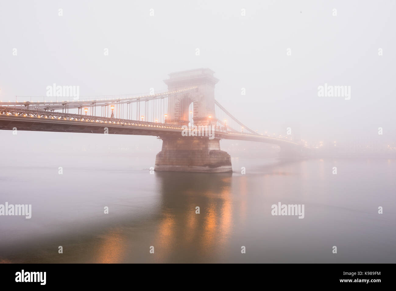 Chain Bridge in Budapest, Hungary, the fog, evening lights Stock Photo ...