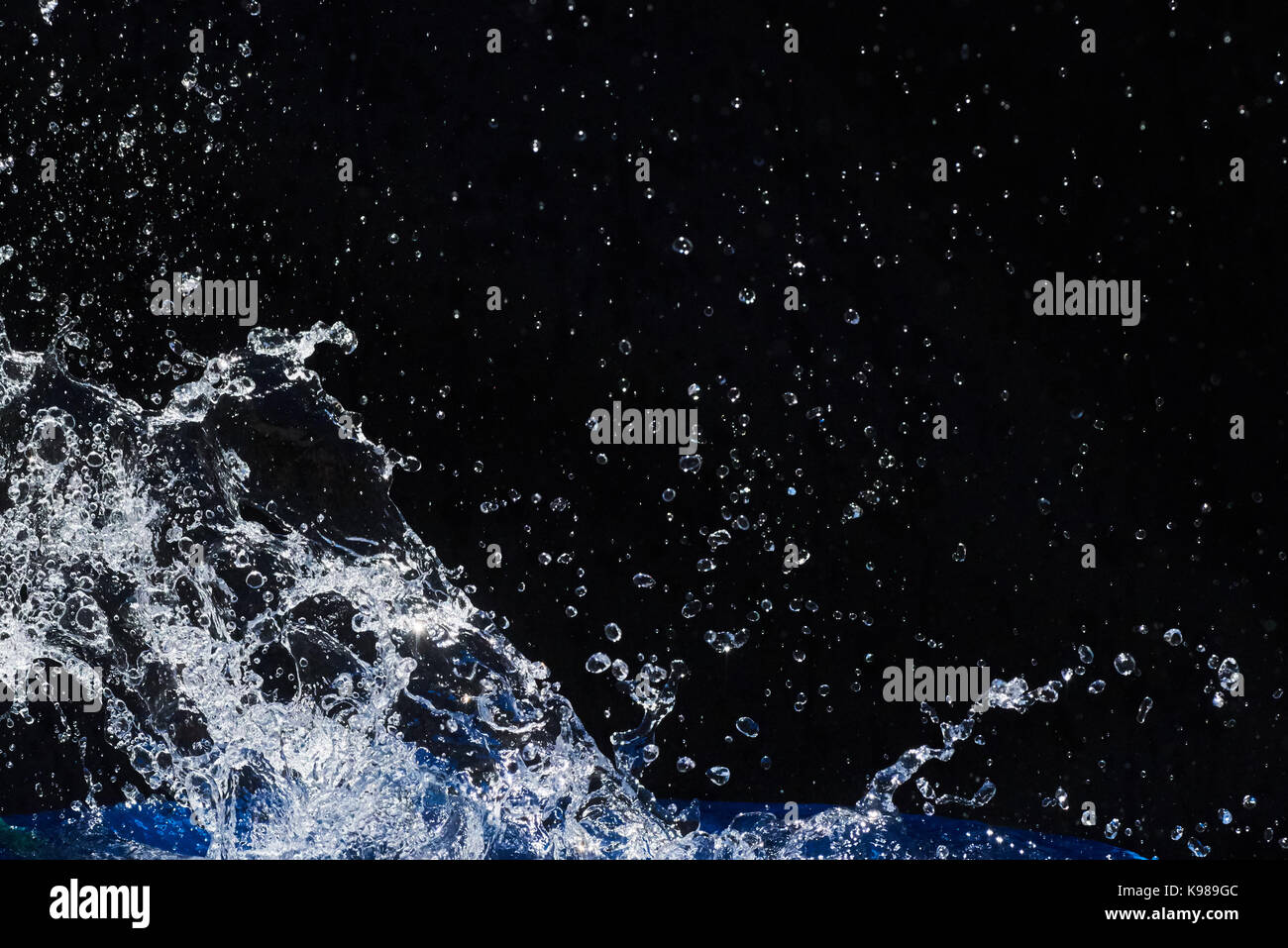 Beautiful blue water drops falling down Stock Photo - Alamy