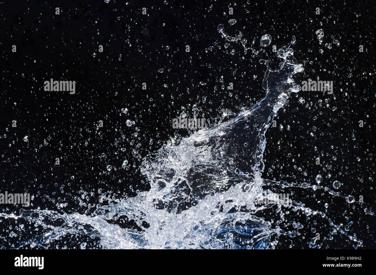 Blue water drops falling down Stock Photo - Alamy