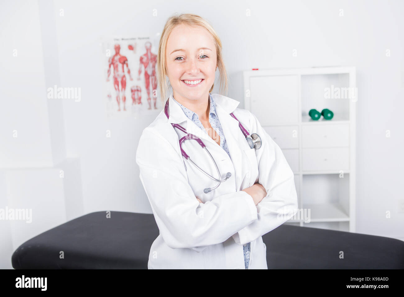 A Portrait of smiling doctor looking at camera in medical office Stock ...