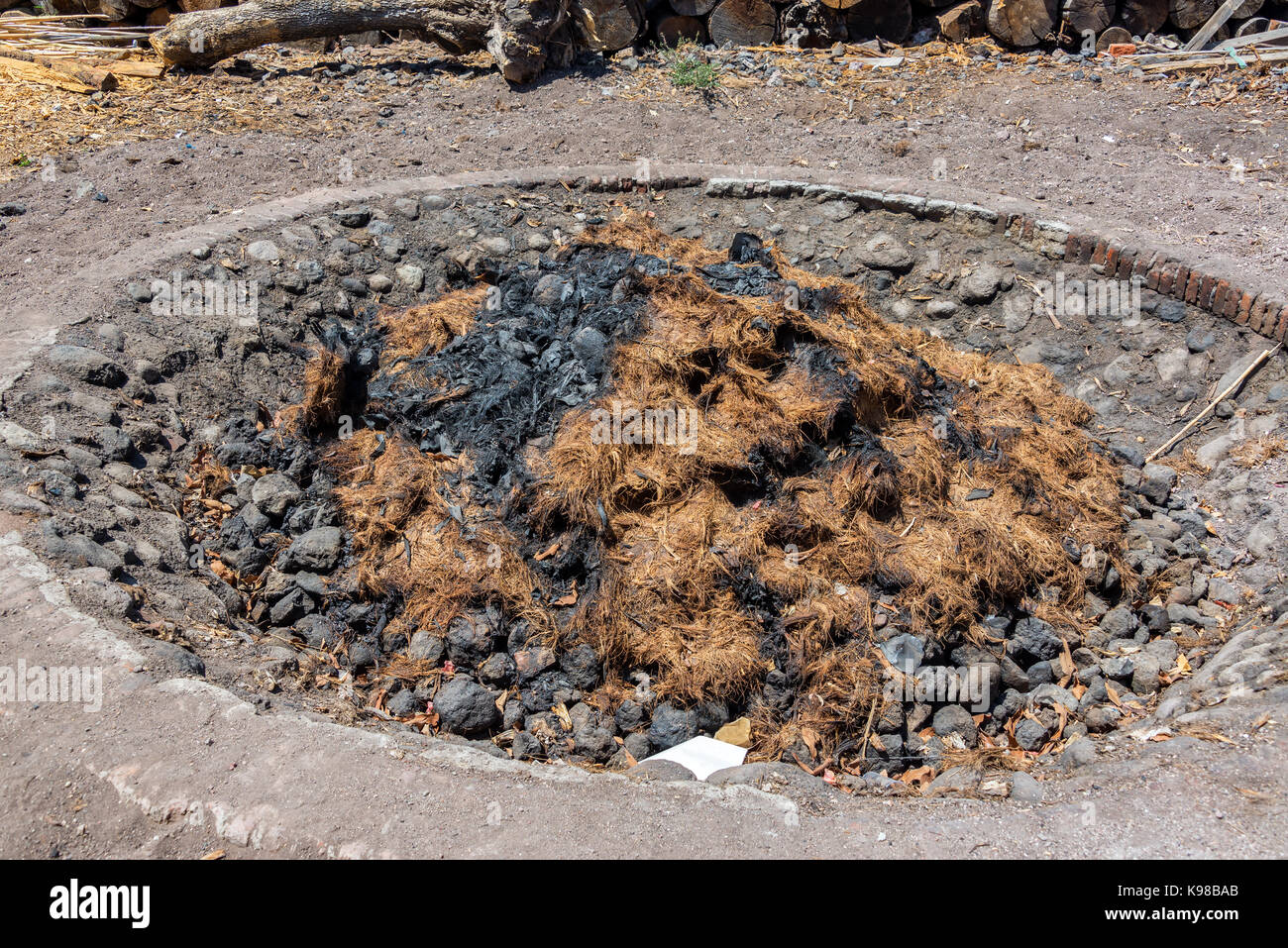 Pit used for burning agave in the production of mezcal in Oaxaca ...