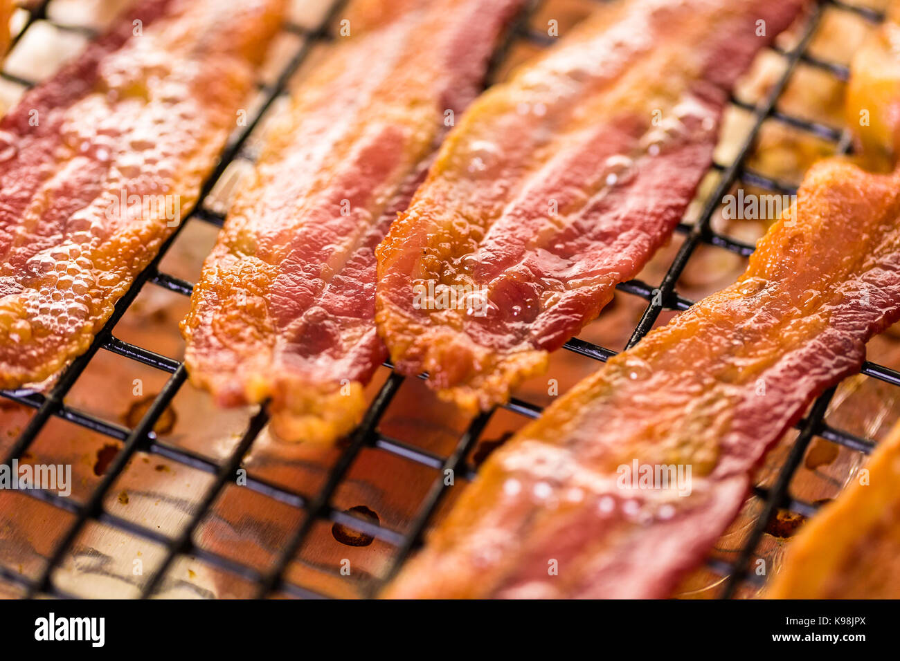 Cooked bacon strips on a baking sheet Stock Photo - Alamy