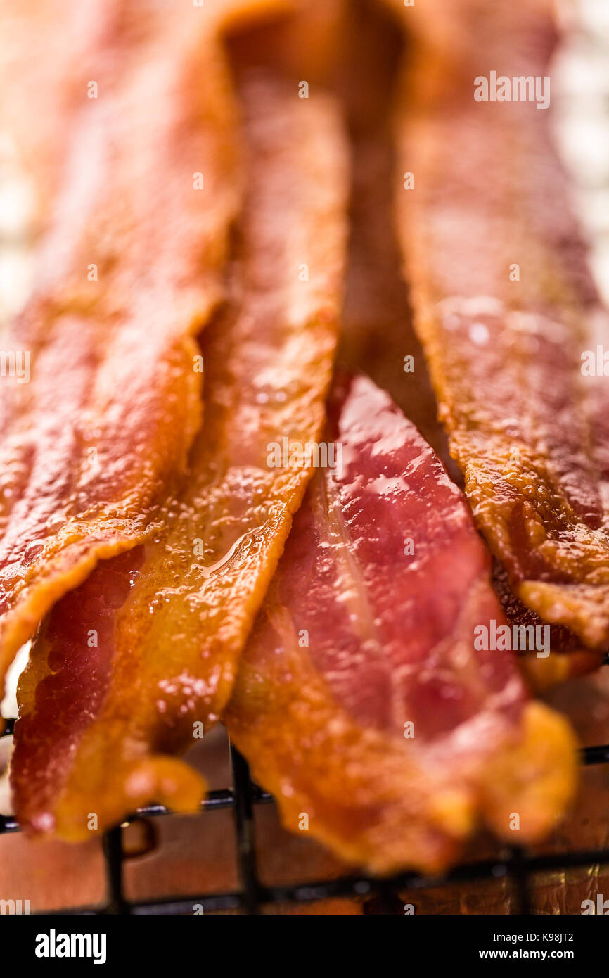 Cooked bacon strips on a baking sheet Stock Photo - Alamy