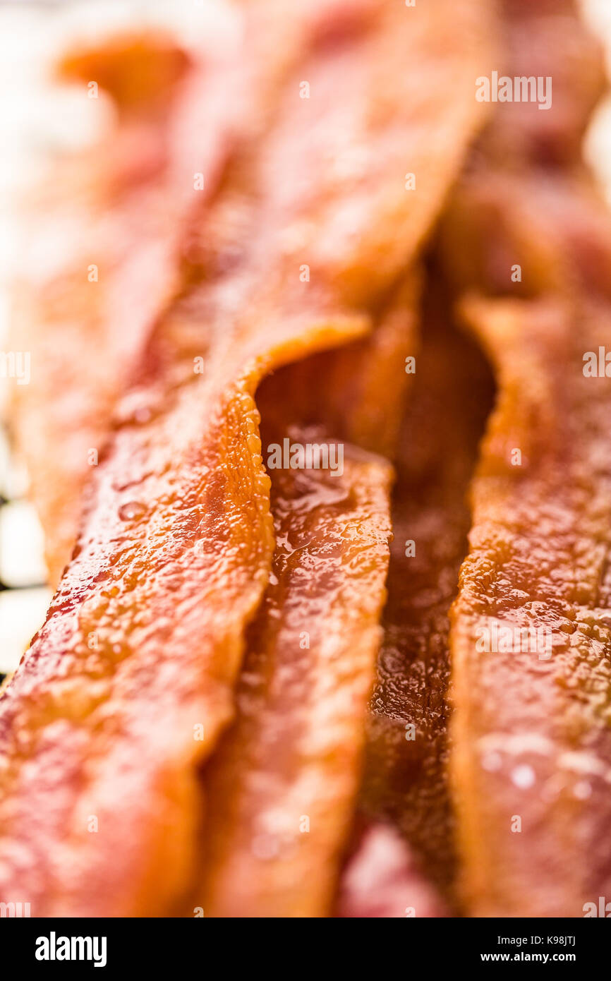 Cooked bacon strips on a baking sheet Stock Photo - Alamy