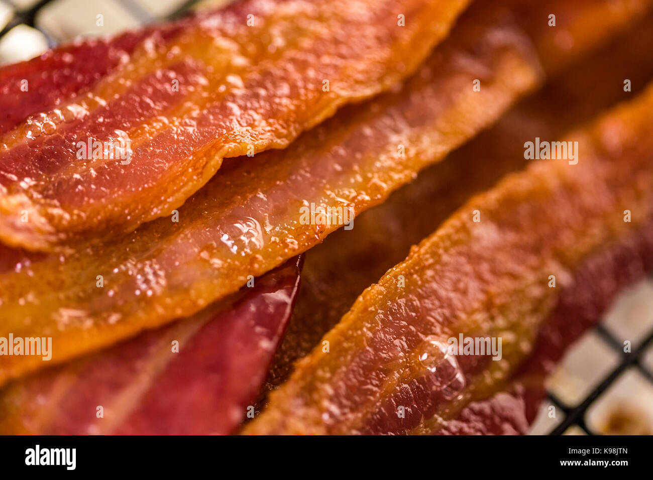 Cooked bacon strips on a baking sheet Stock Photo - Alamy