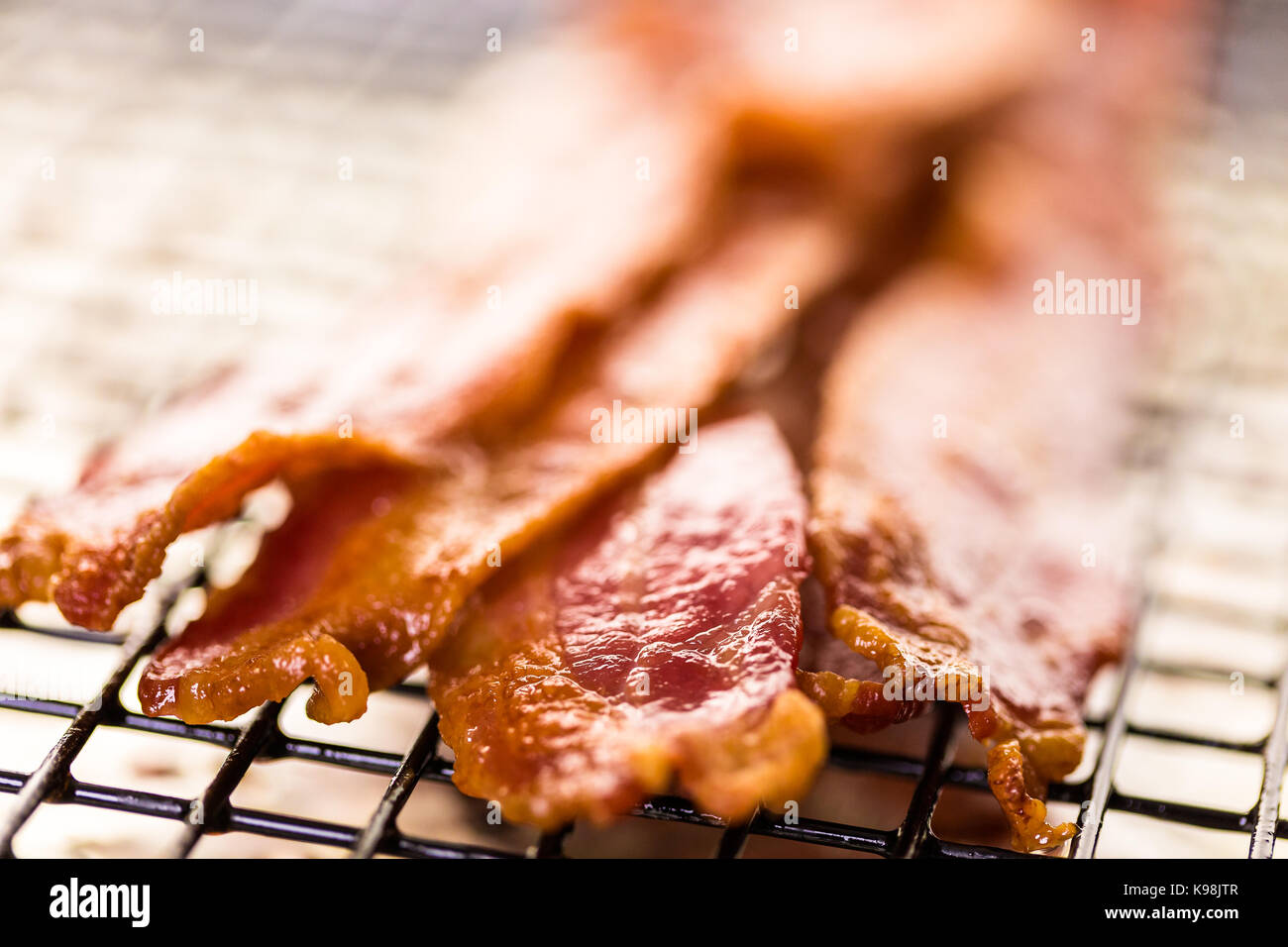 Cooked bacon strips on a baking sheet Stock Photo - Alamy