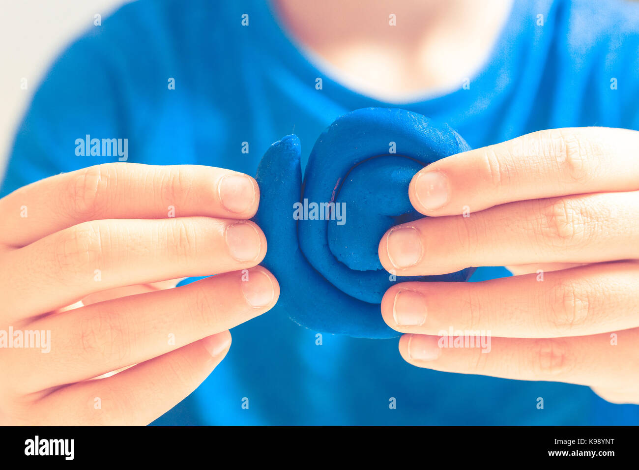 Child hands making toy figure with modeling clay or plasticine Stock ...