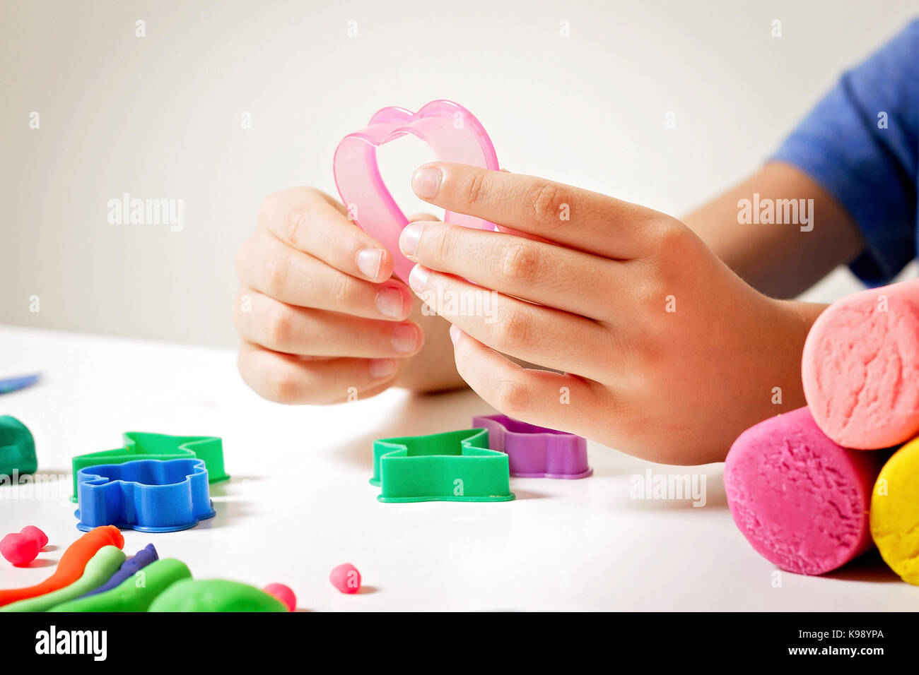 Child playing modeling clay hi-res stock photography and images - Alamy