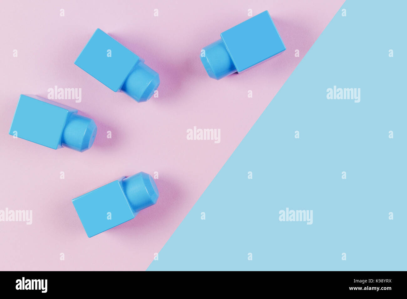 Blue plastic construction blocks on pink and blue background Stock ...