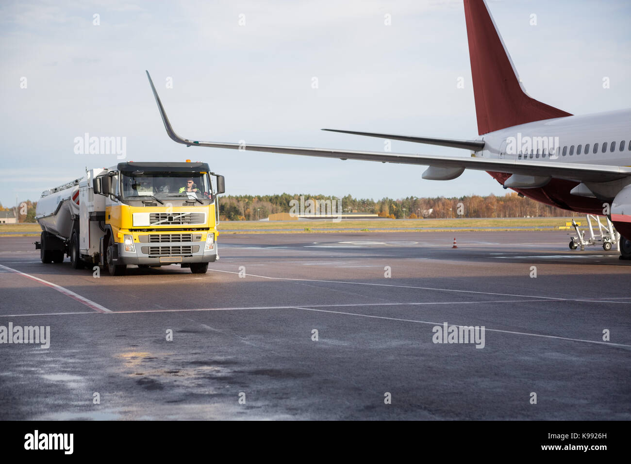 Truck Moving By Airplane On Runway Stock Photo - Alamy
