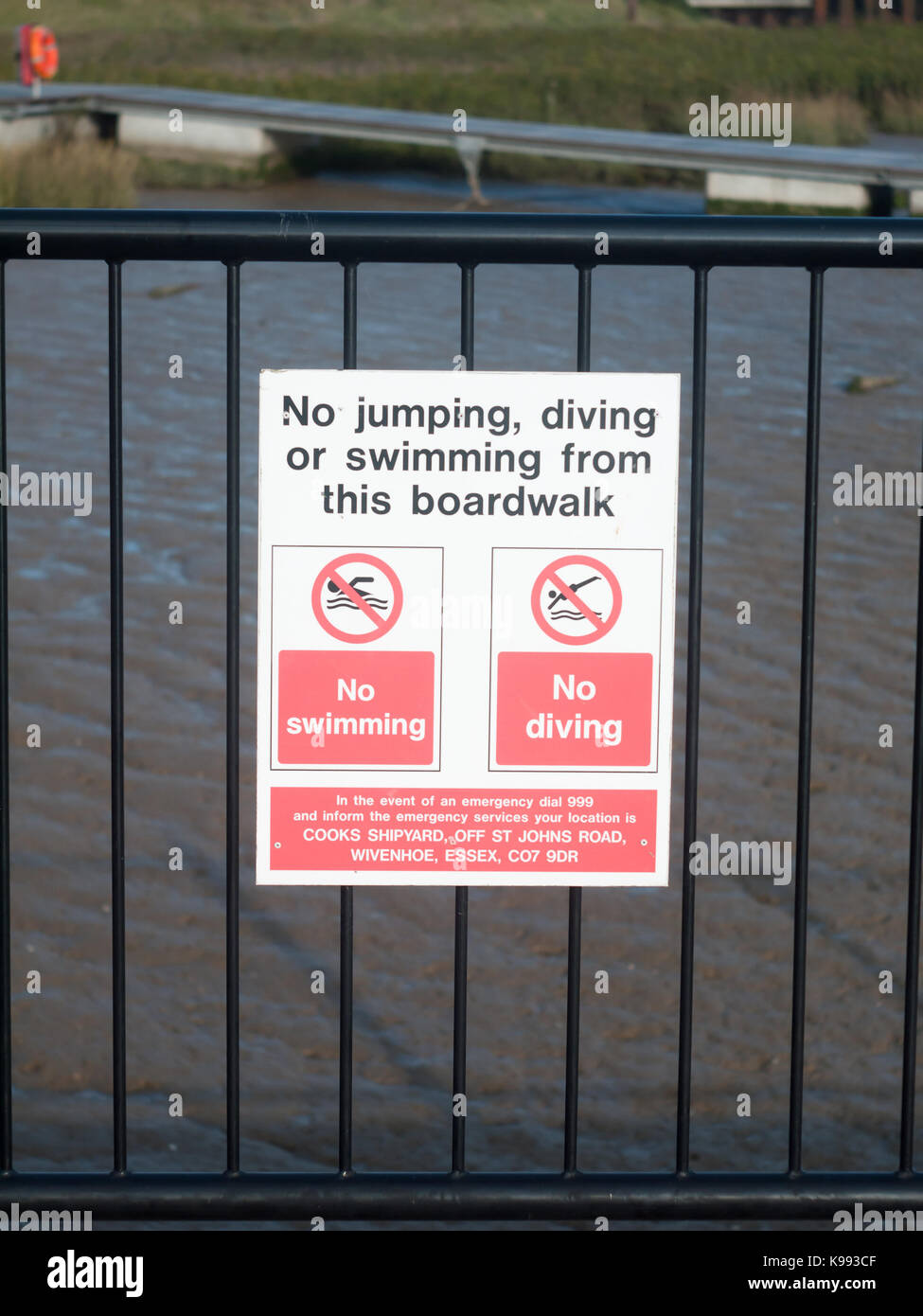 no jumping, diving or swimming from this boardwalk sign on railings at ...