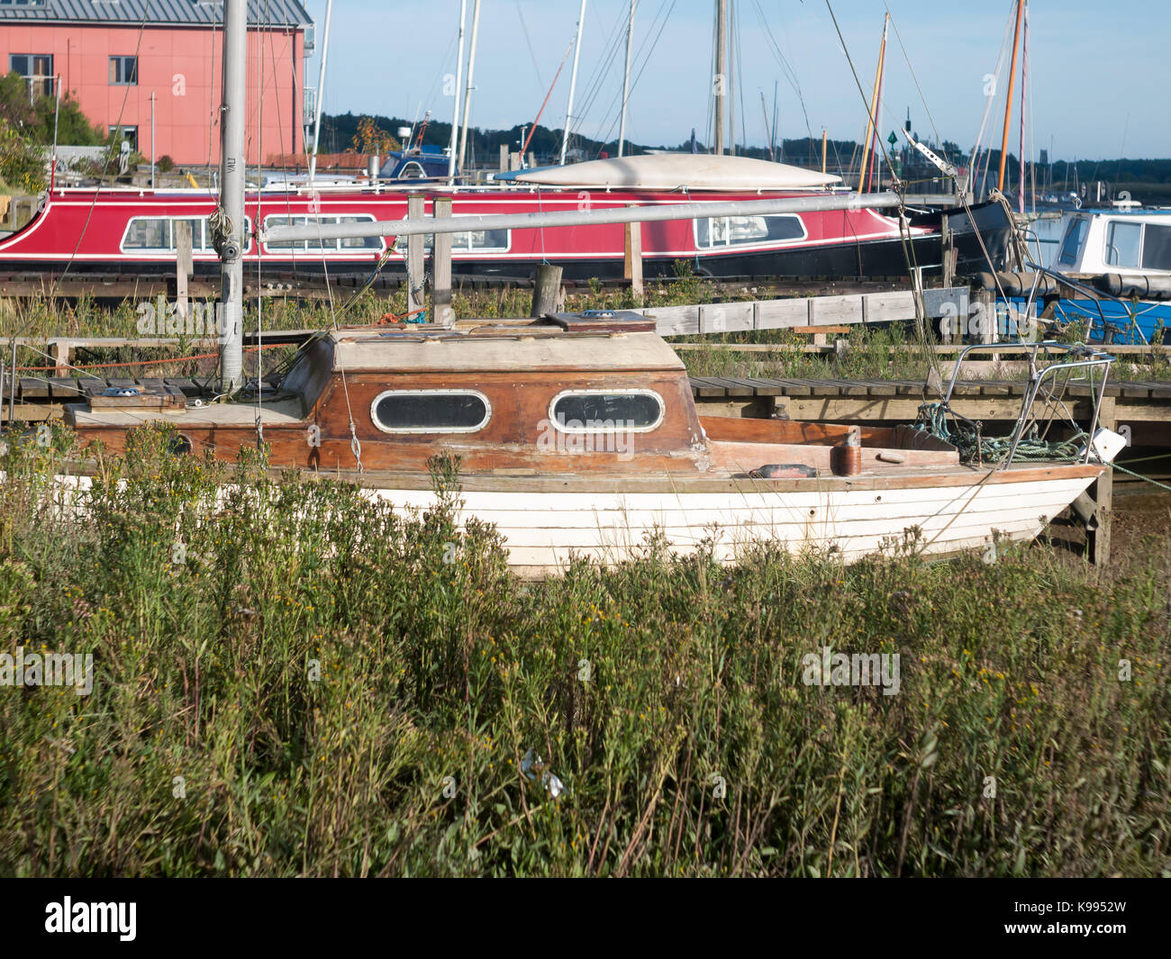 wooden old boat moored in small town dock; England; Essex Stock Photo ...