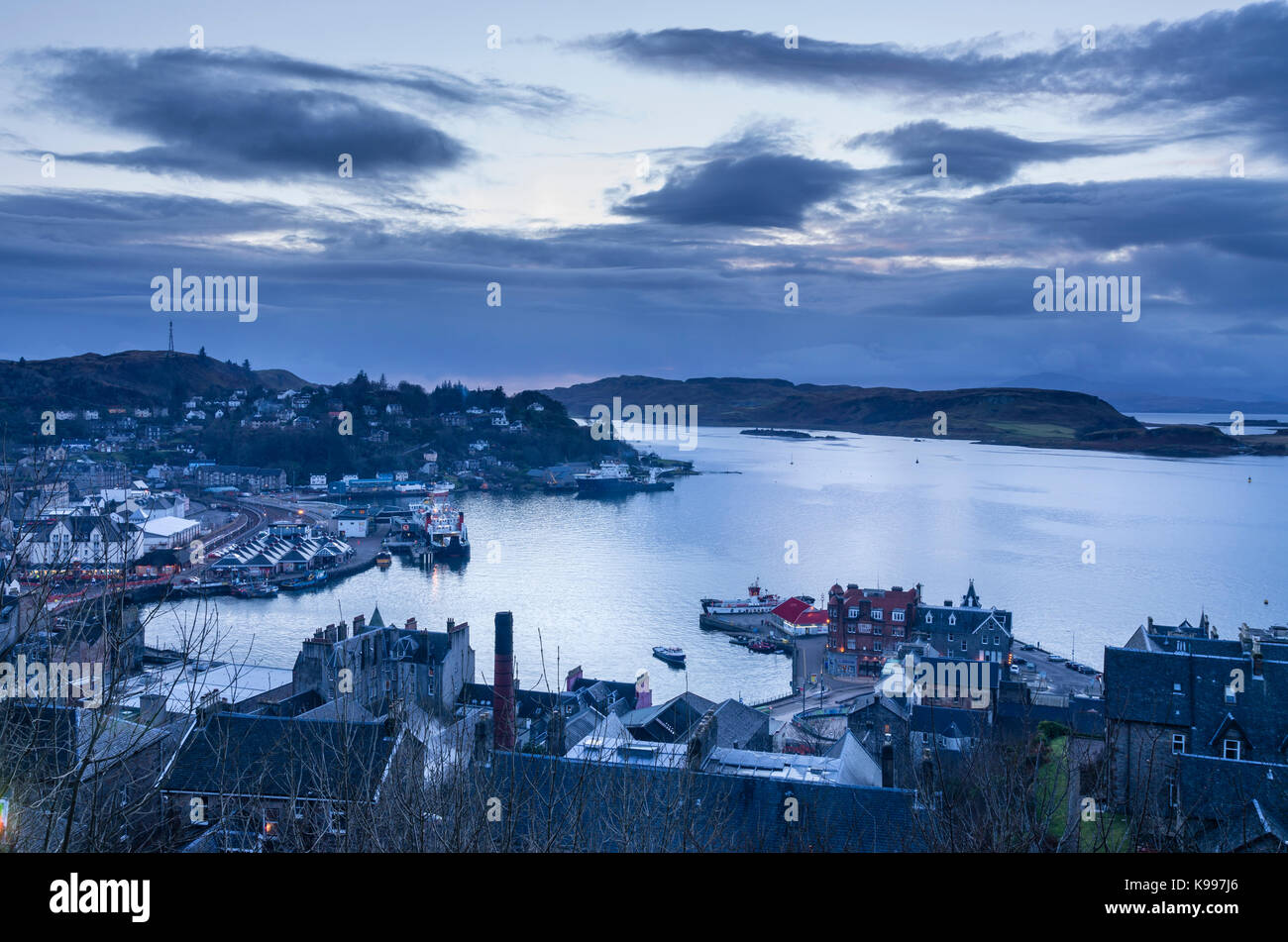 Oban town centre in the evening twilight at dusk from McCaig's Tower ...
