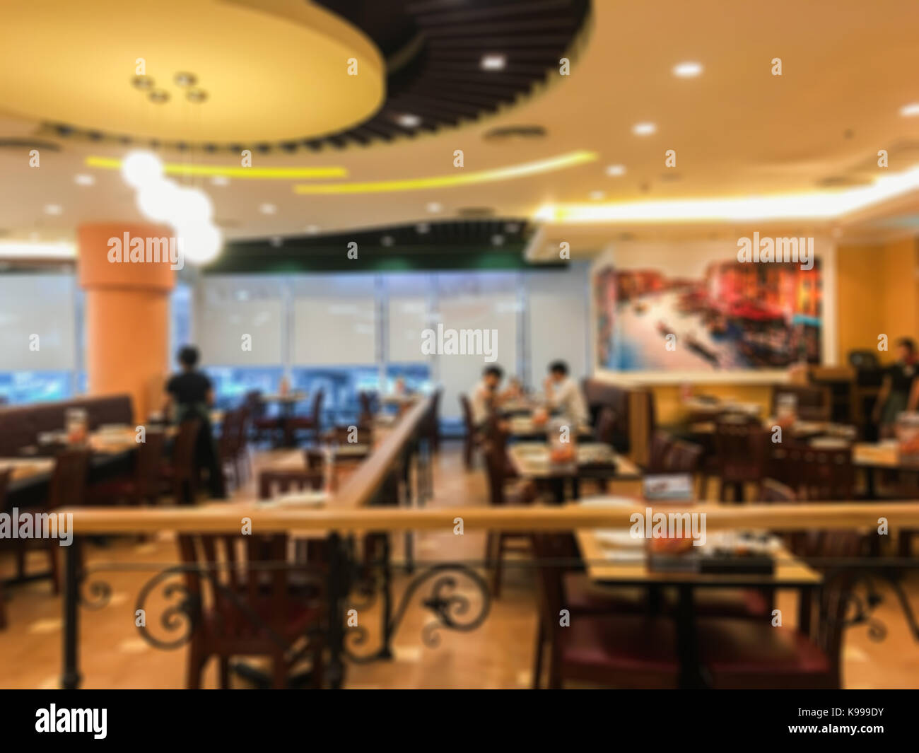 The Restaurant background on orange tone, picture blur Stock Photo - Alamy