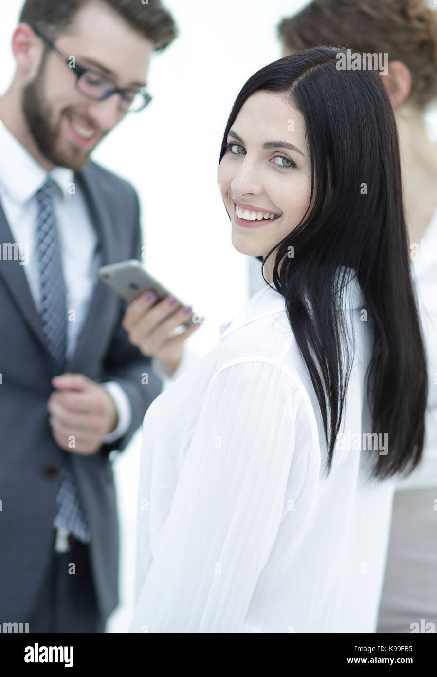 close-up of a beautiful woman manager and co-workers in the office ...