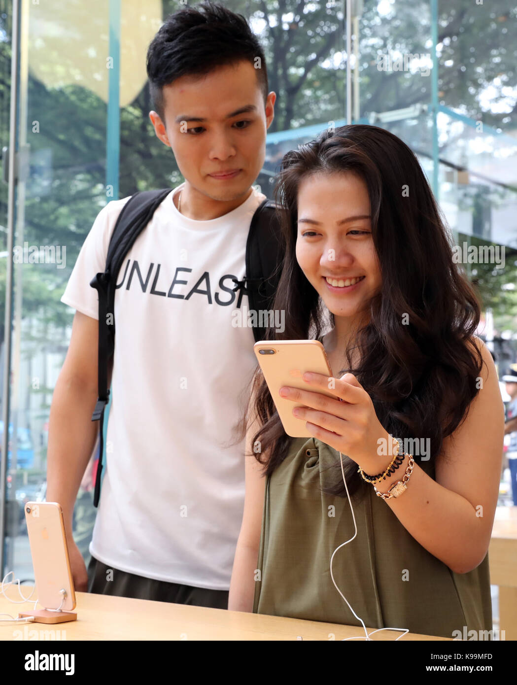 Tokyo, Japan. 22nd Sep, 2017. Customers check Apple's new iPhone 8 at ...