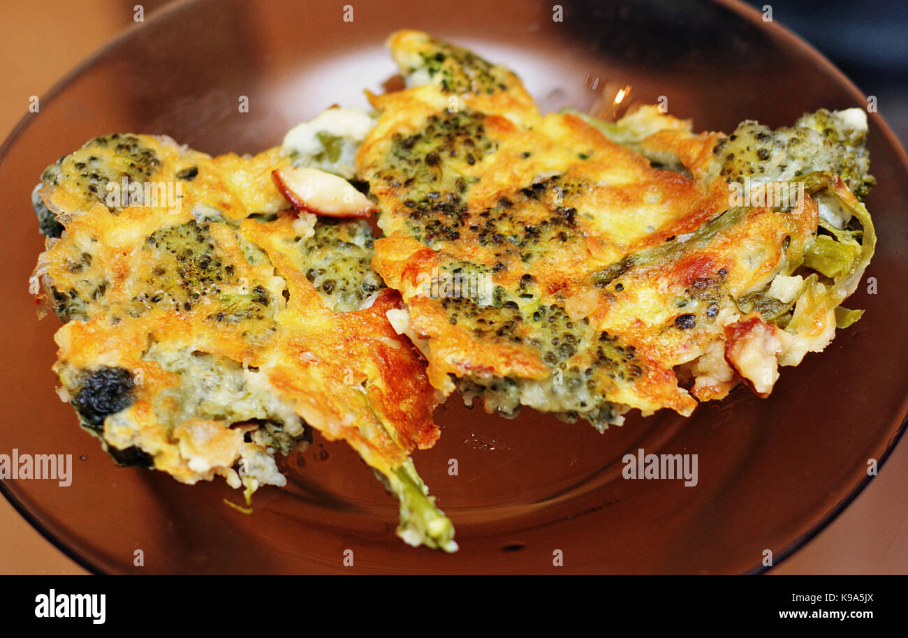 Fried cabbage of broccoli with battered vegetables and spices Stock ...