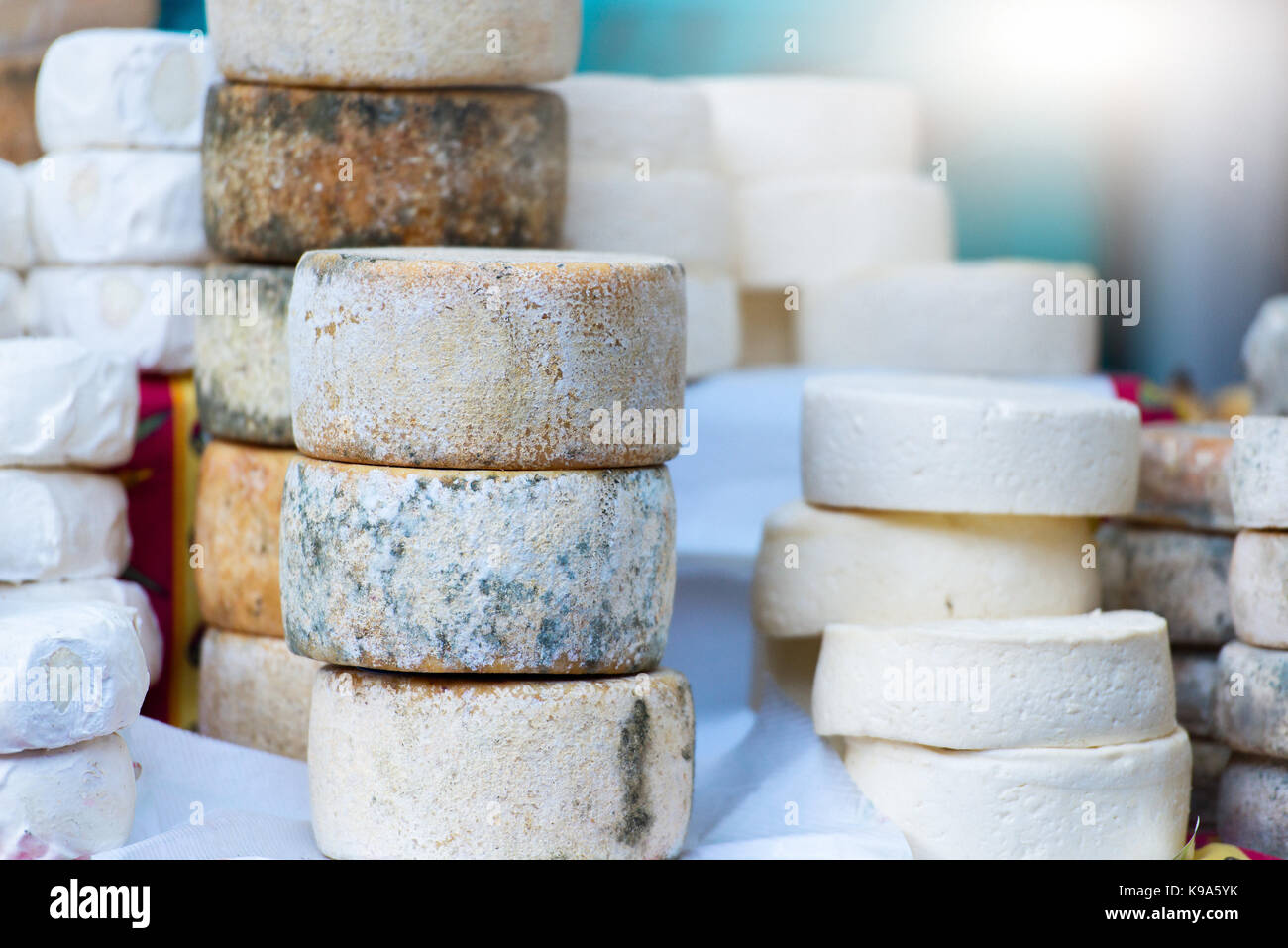Traditional artisan cheese wheels composition Stock Photo - Alamy