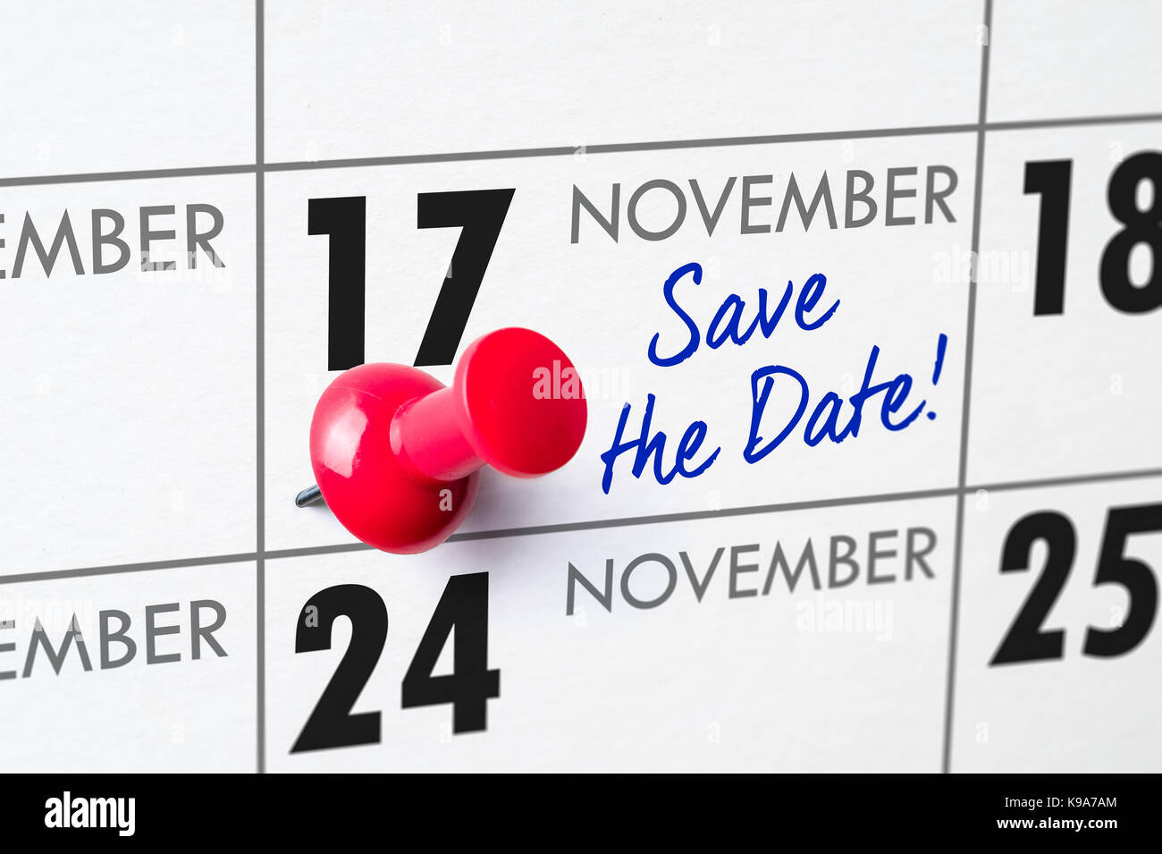 Wall calendar with a red pin - November 17 Stock Photo - Alamy