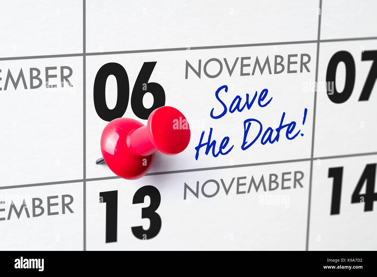 Wall calendar with a red pin - November 06 Stock Photo - Alamy