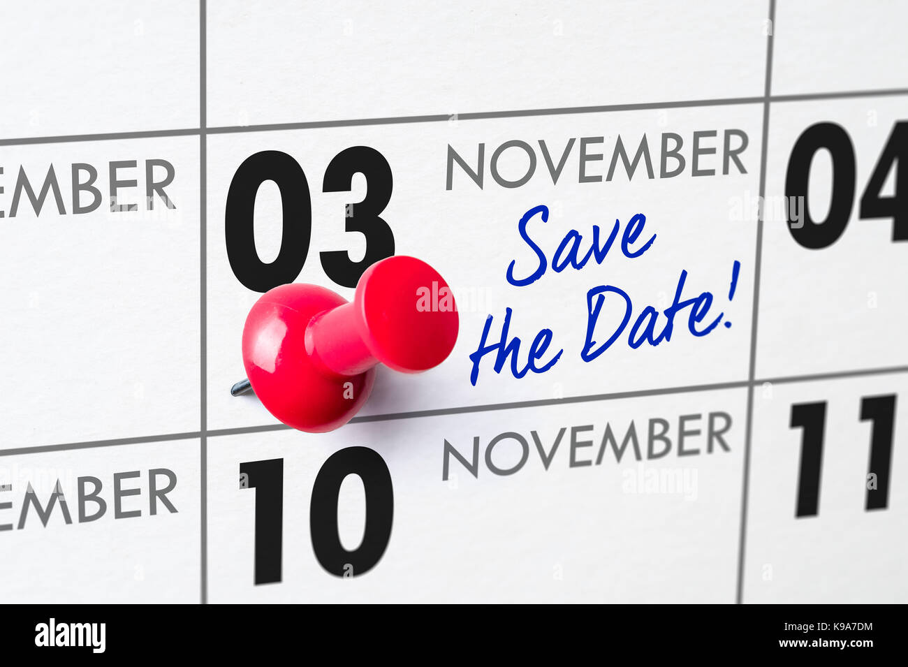 Wall calendar with a red pin - November 03 Stock Photo - Alamy