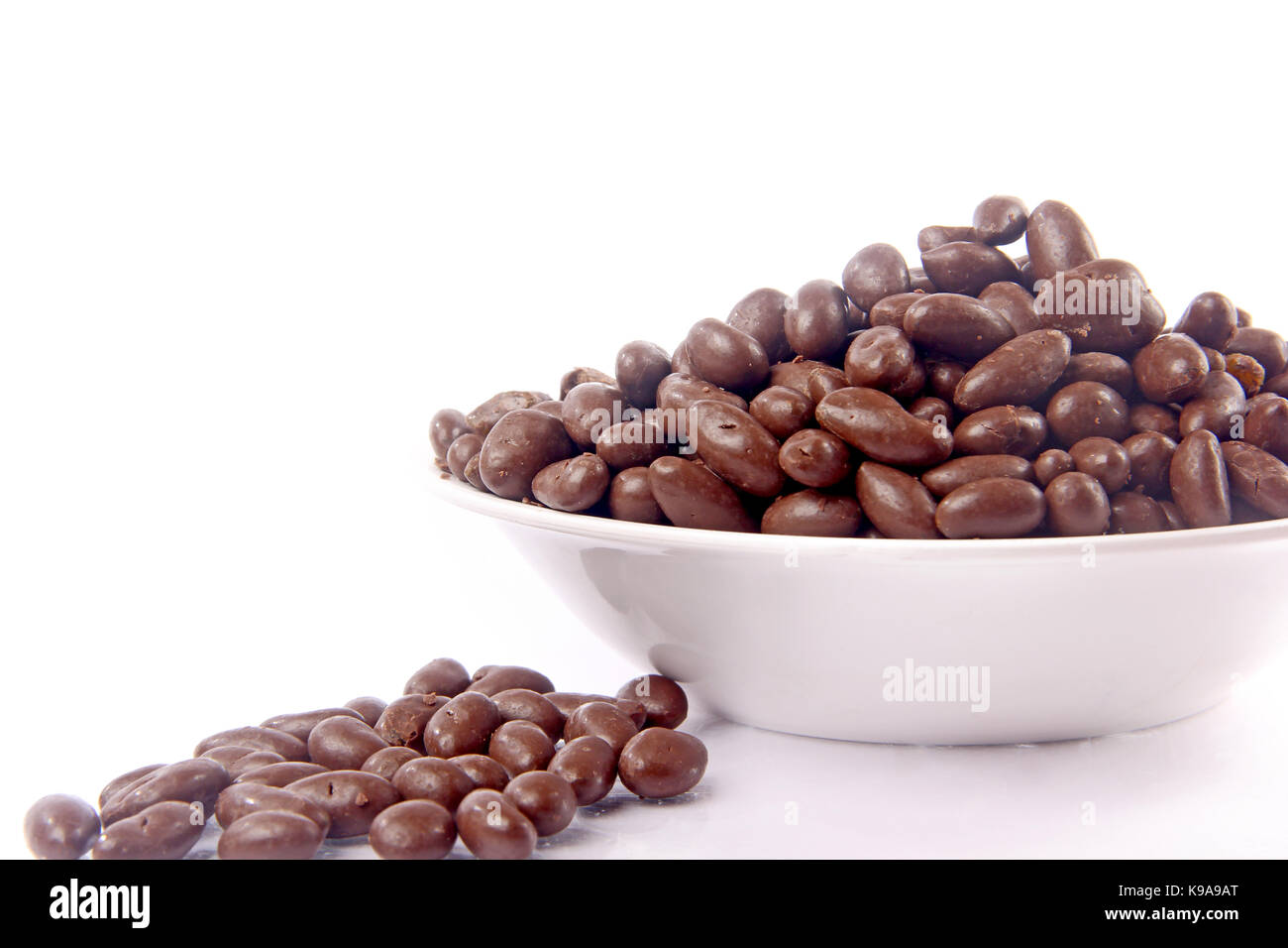 Chocolate almond in bowl Stock Photo - Alamy