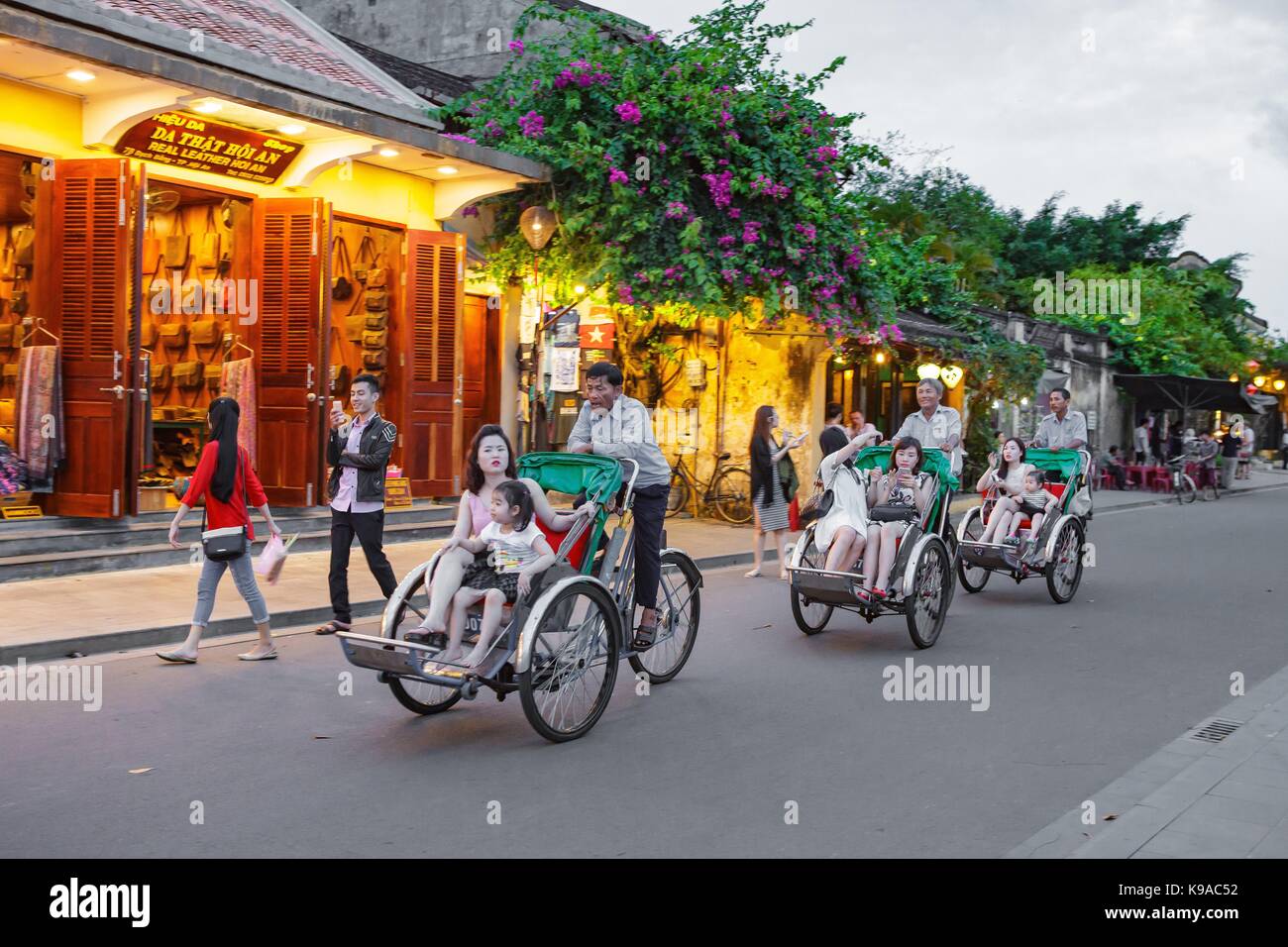 HOI AN, VIETNAM - MARCH 15, 2017: local Vietnam man riding a ...