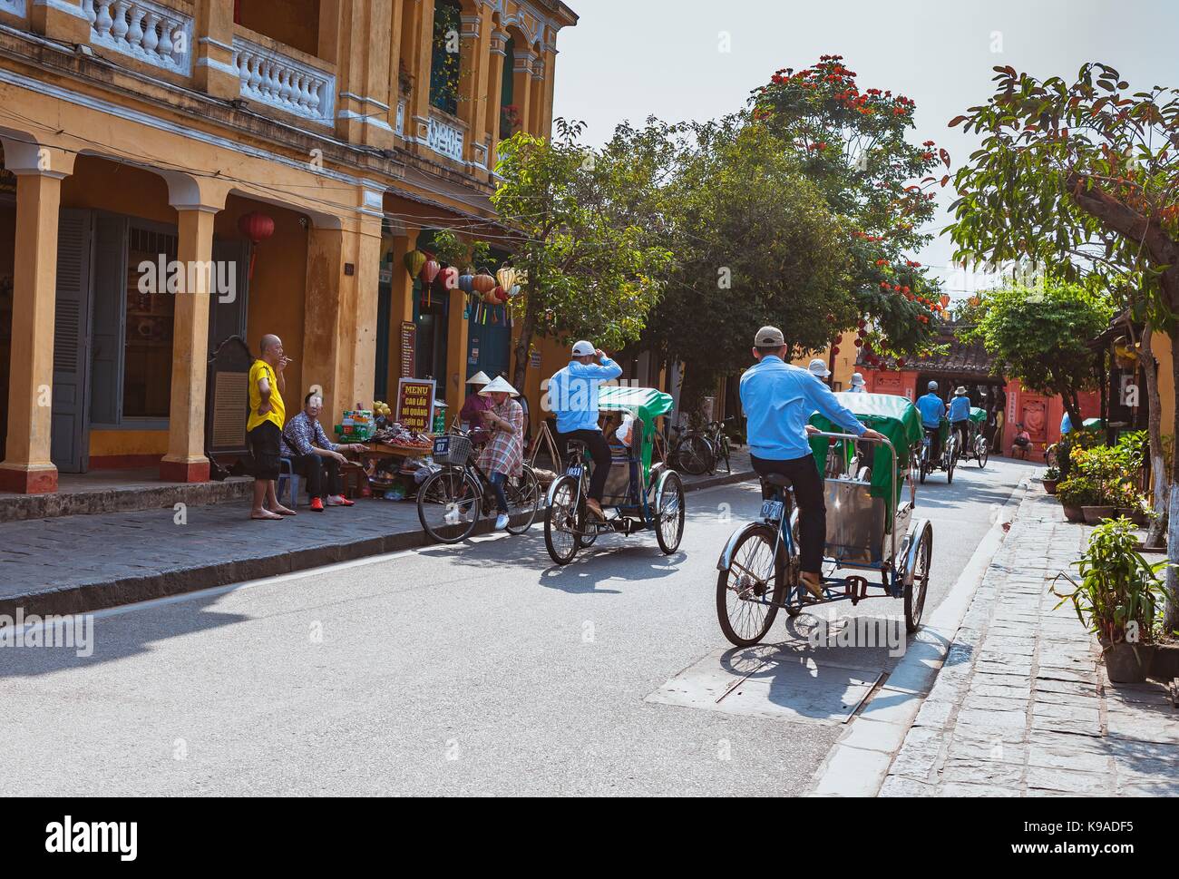 HOI AN, VIETNAM - MARCH 15, 2017: local Vietnam man riding a ...