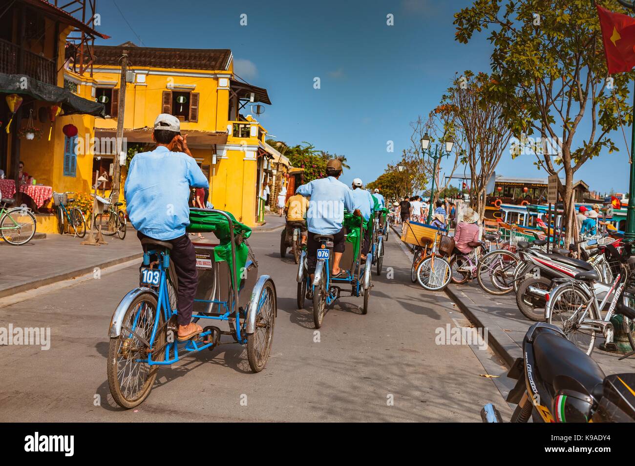 HOI AN, VIETNAM - MARCH 15, 2017: local Vietnam man riding a ...