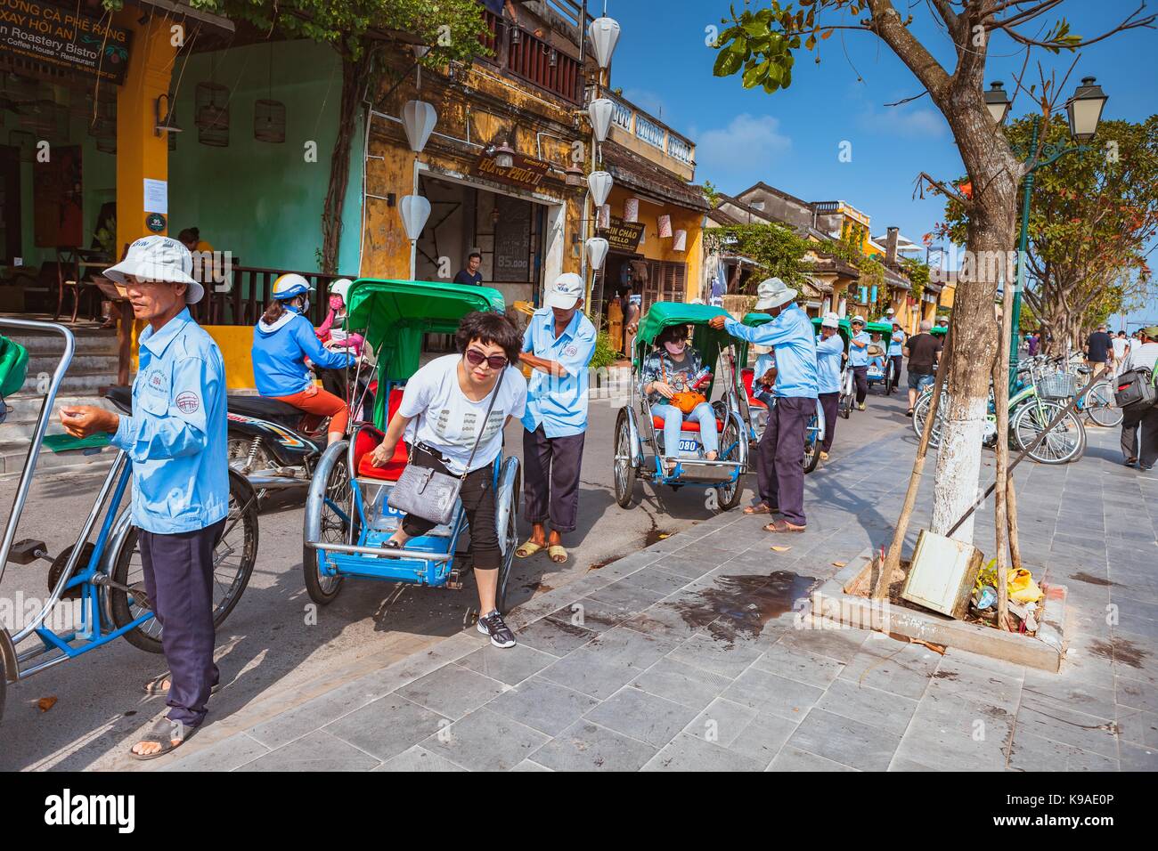 HOI AN, VIETNAM - MARCH 15, 2017: local Vietnam man riding a ...