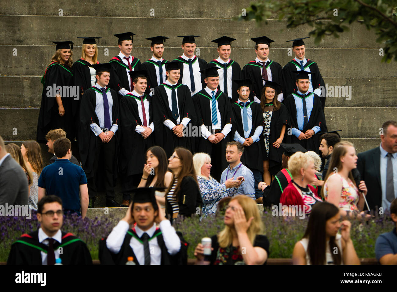 Uk graduates wearing academic gowns hi-res stock photography and images ...
