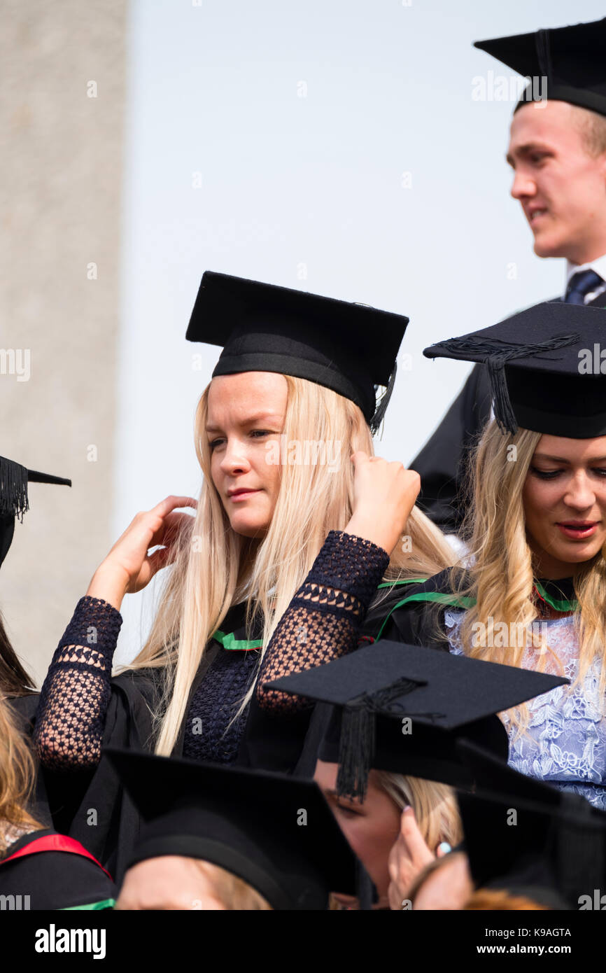 Uk graduates wearing academic gowns hi-res stock photography and images ...