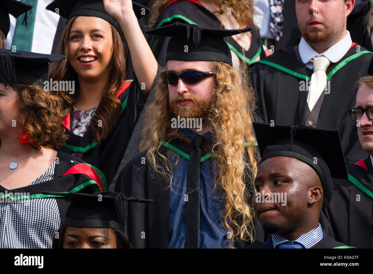 Uk graduates wearing academic gowns hi-res stock photography and images ...