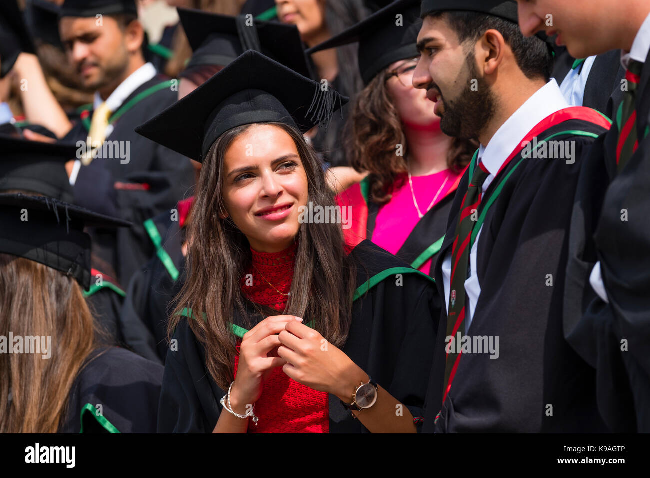 Uk graduates wearing academic gowns hi-res stock photography and images ...
