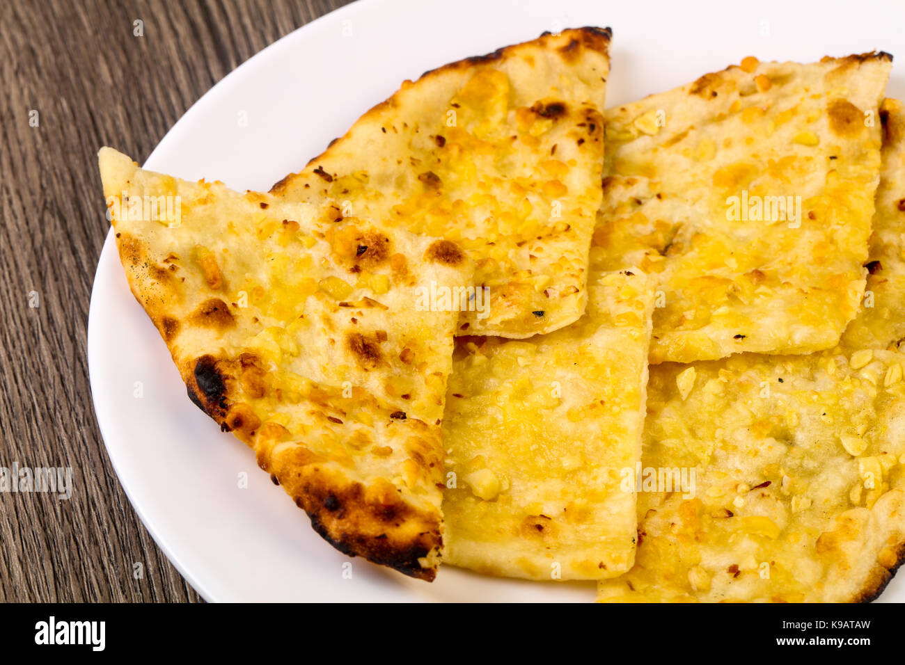 Indian bread - Naan with cheese and garlic Stock Photo - Alamy