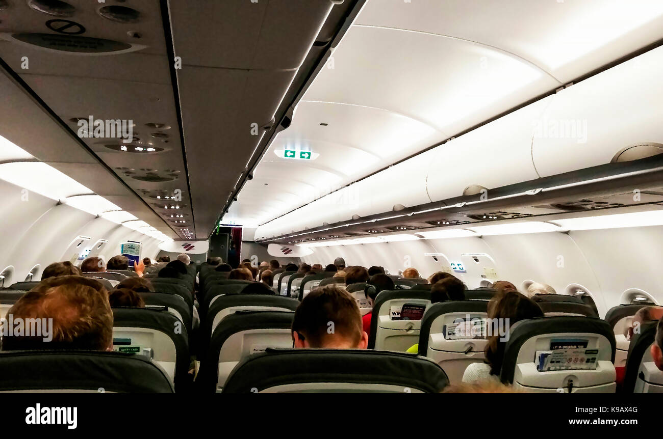 Interior airplane passengers on seats hi-res stock photography and ...