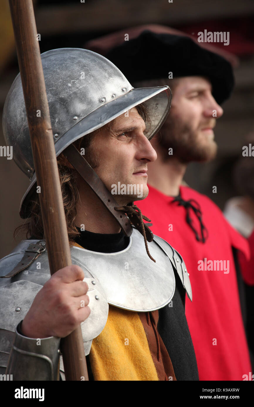 Background actor dressed as a medieval guard attends the filming of the ...