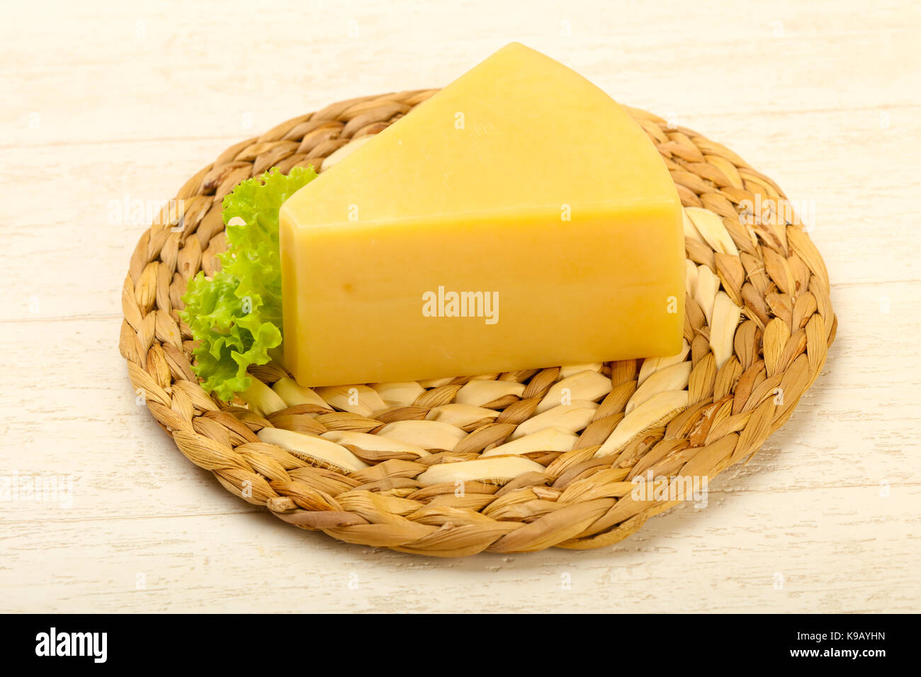 Parmesan cheese triangle Stock Photo - Alamy