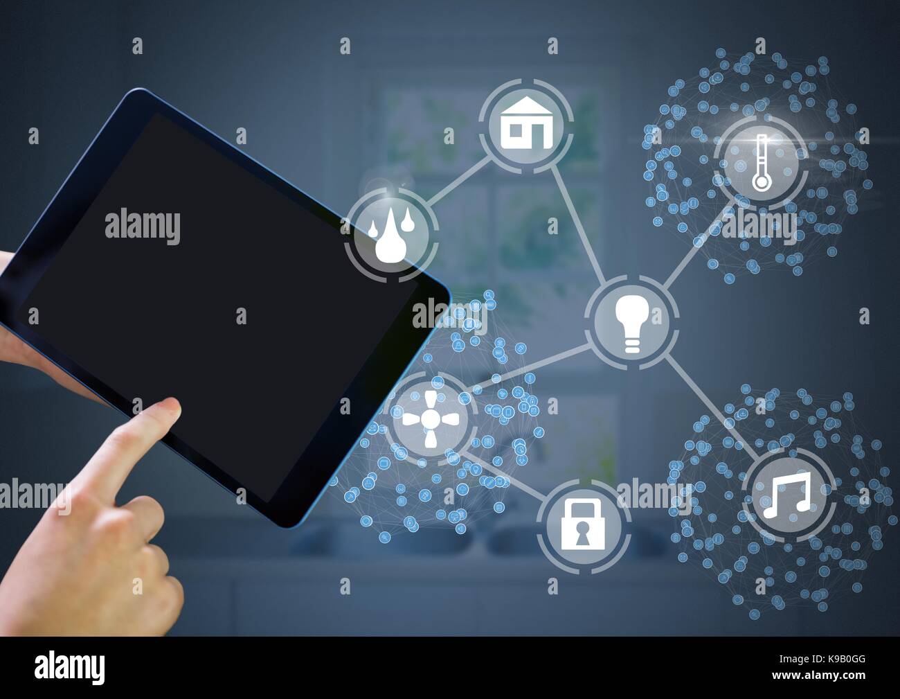 Digital composite of Hand holding tablet with smart home interface and ...