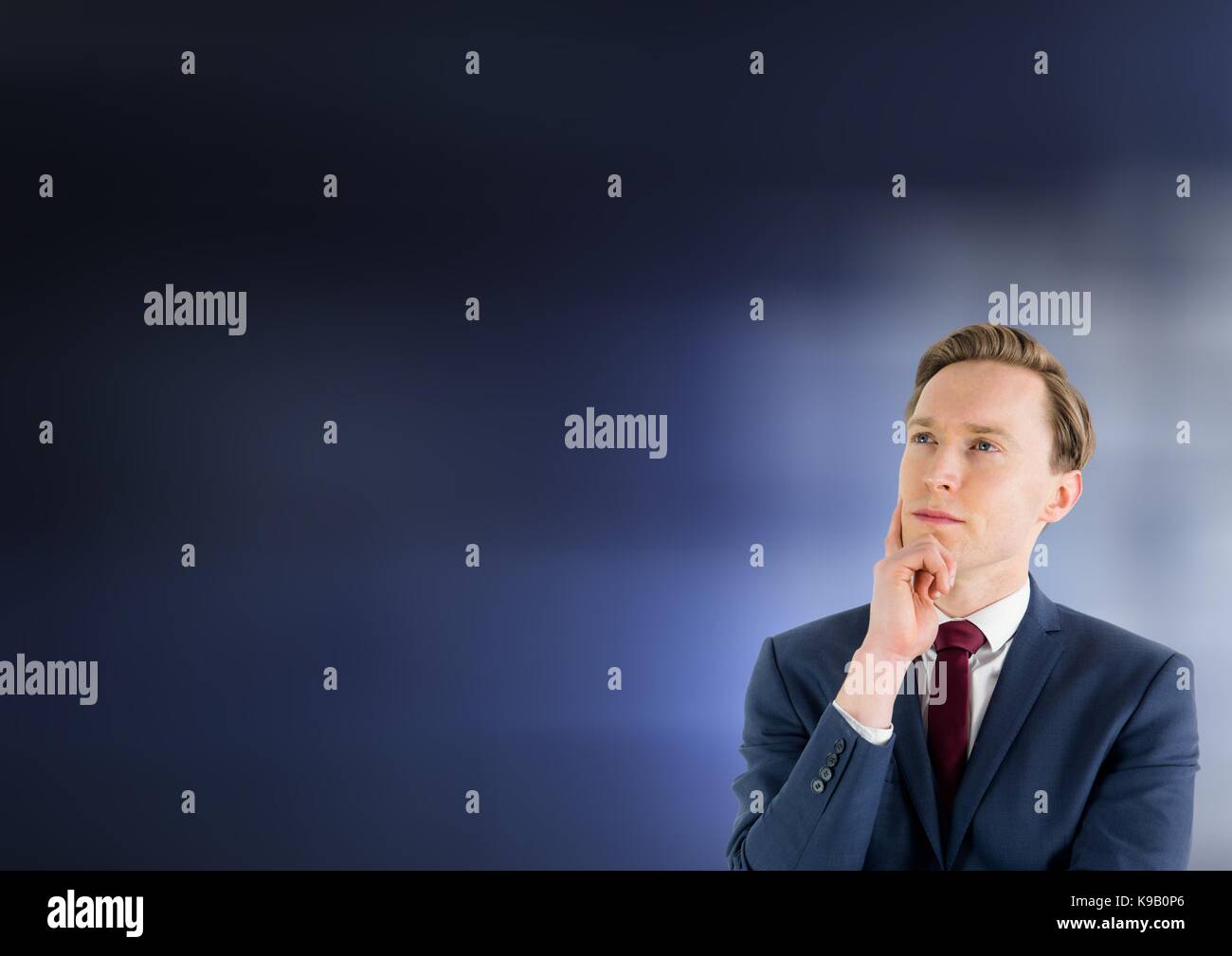 Digital composite of Businessman thinking on purple background Stock ...