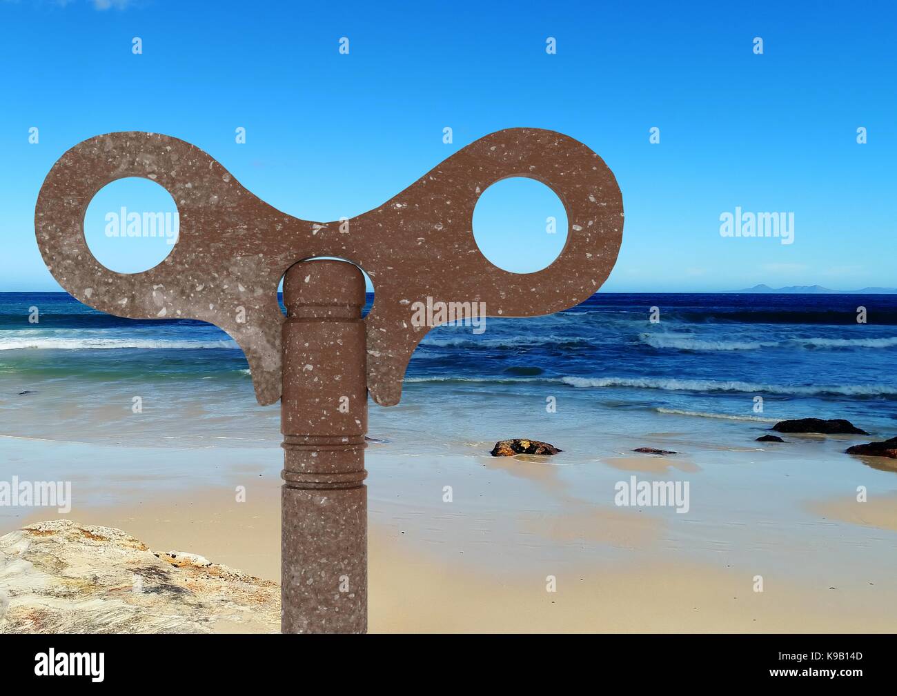 Digital composite of Rustic key over beach Stock Photo - Alamy