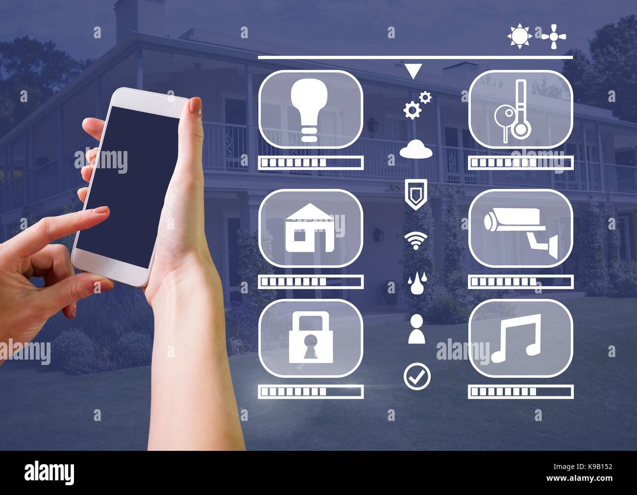 Digital composite of Hand holding phone with smart home interface at ...
