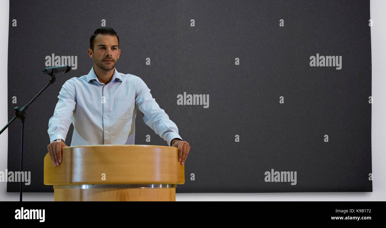 Digital composite of presenter at blackboard Stock Photo - Alamy