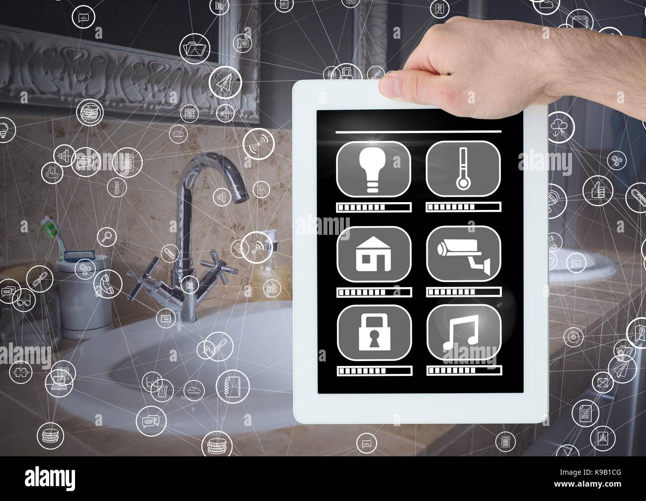 Digital composite of Hand holding tablet with smart home interface and ...