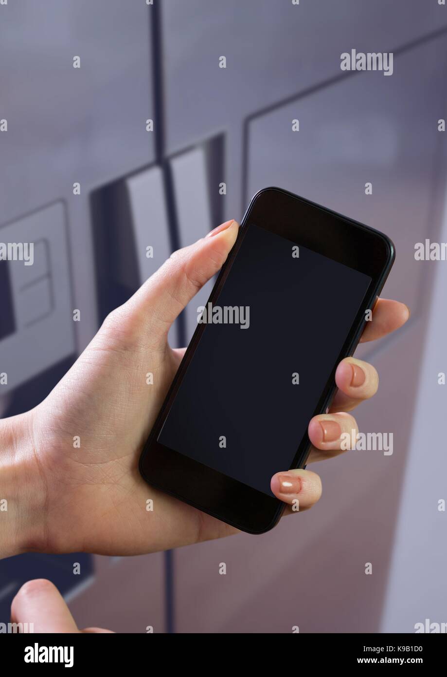 Digital composite of Hand holding phone at home Stock Photo - Alamy