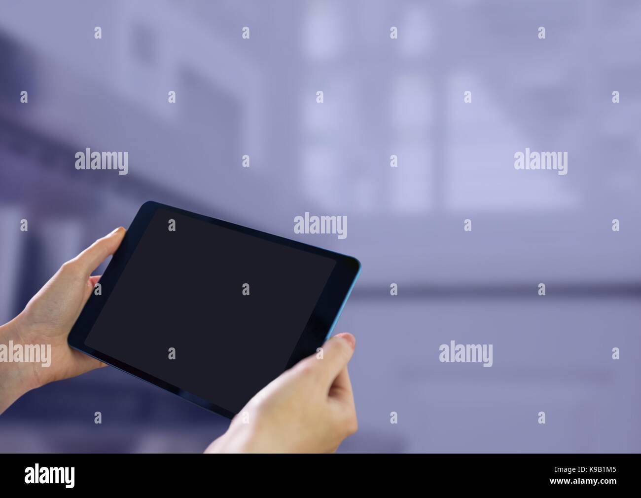 Digital composite of Hand holding tablet at home Stock Photo - Alamy