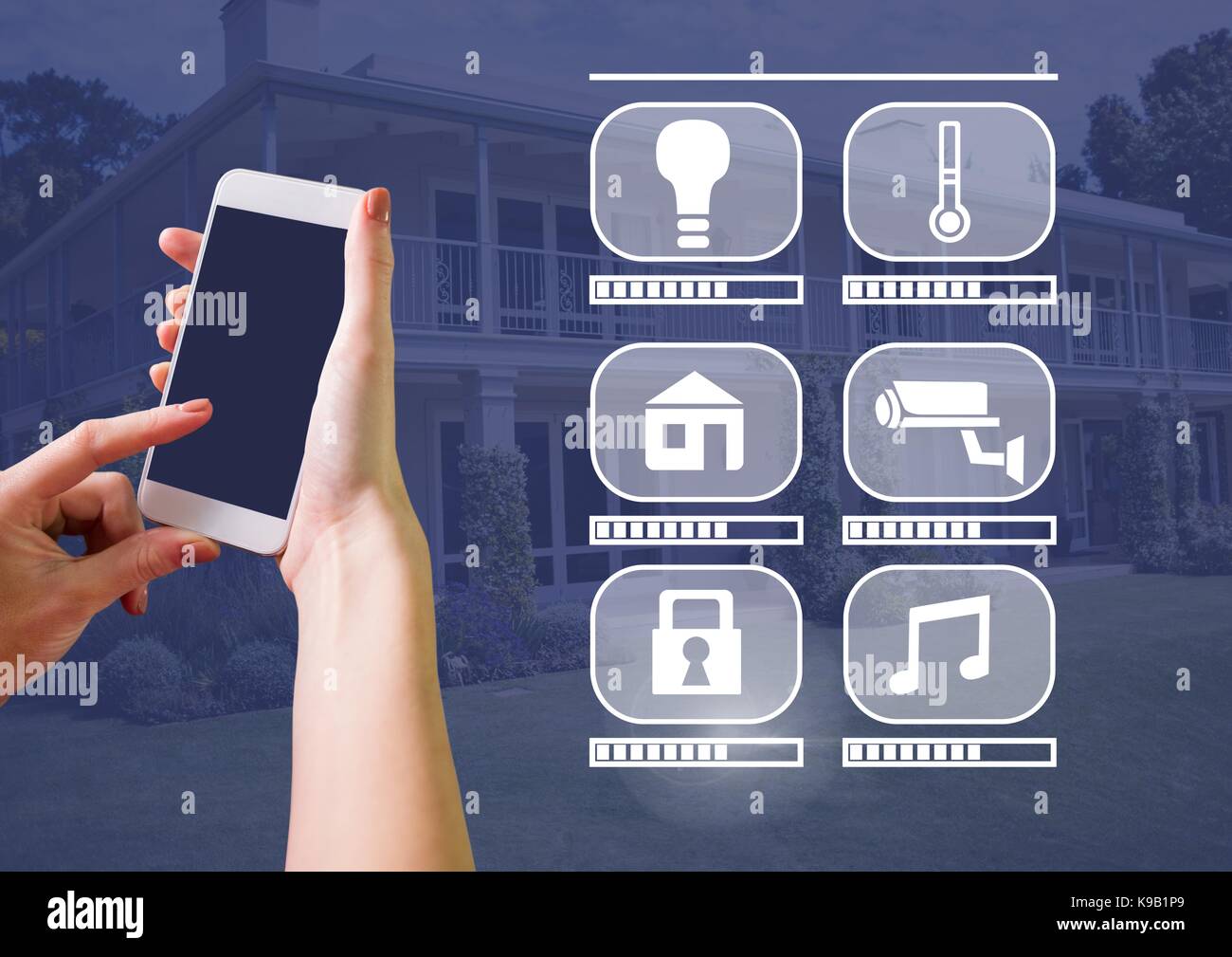 Digital composite of Hand holding phone with smart home interface at ...