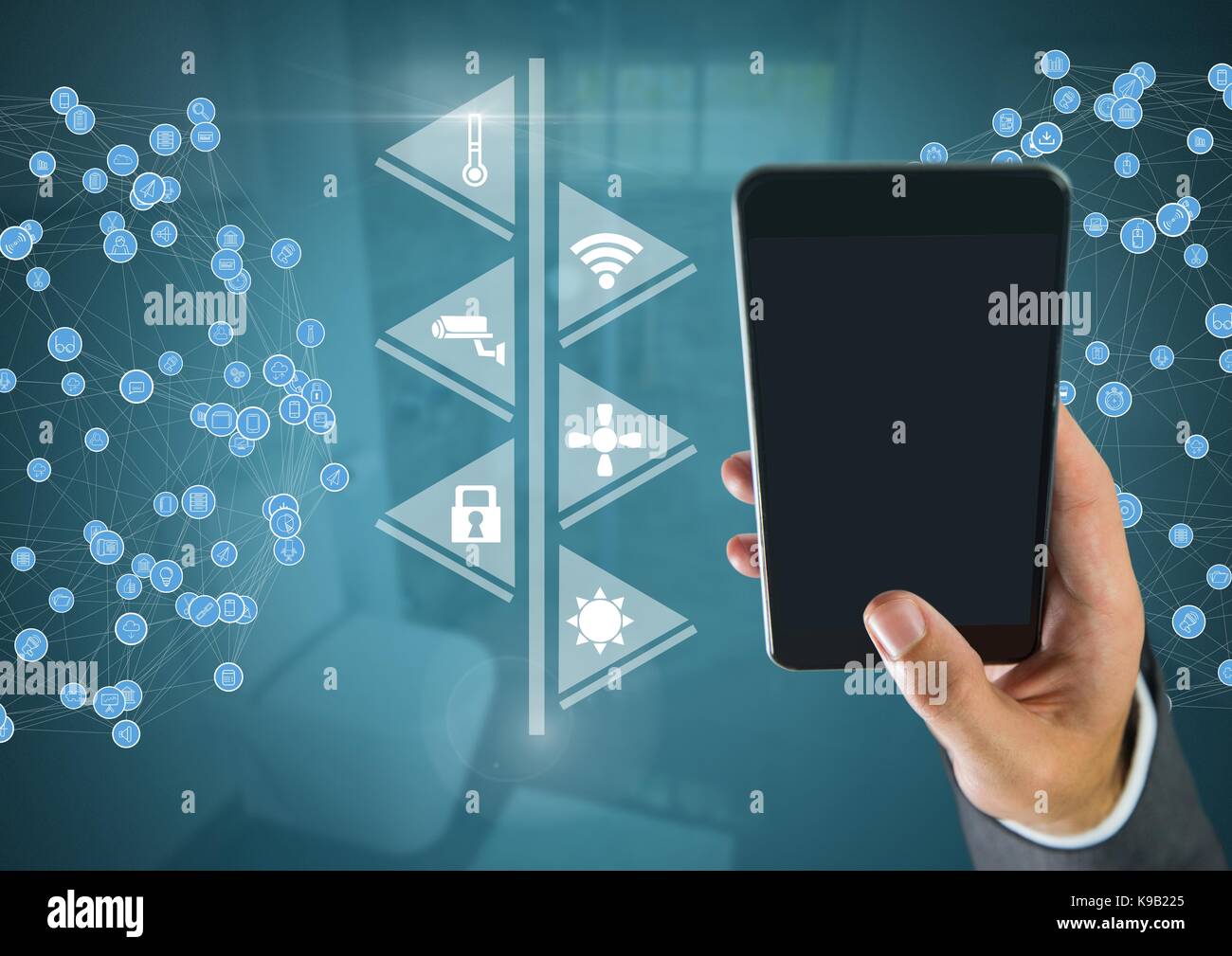 Digital composite of Hand holding phone with smart home interface and ...